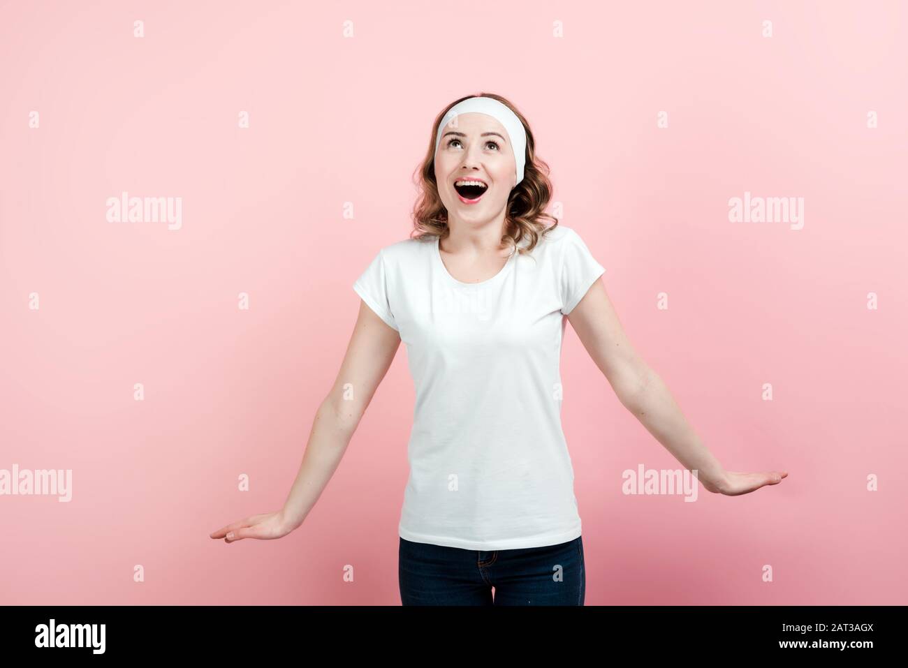 Surprised woman arms up isolated hi-res stock photography and images ...