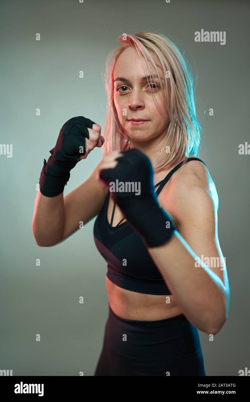 Woman fighter doing shadow boxking with hands wrapped Stock Photo - Alamy