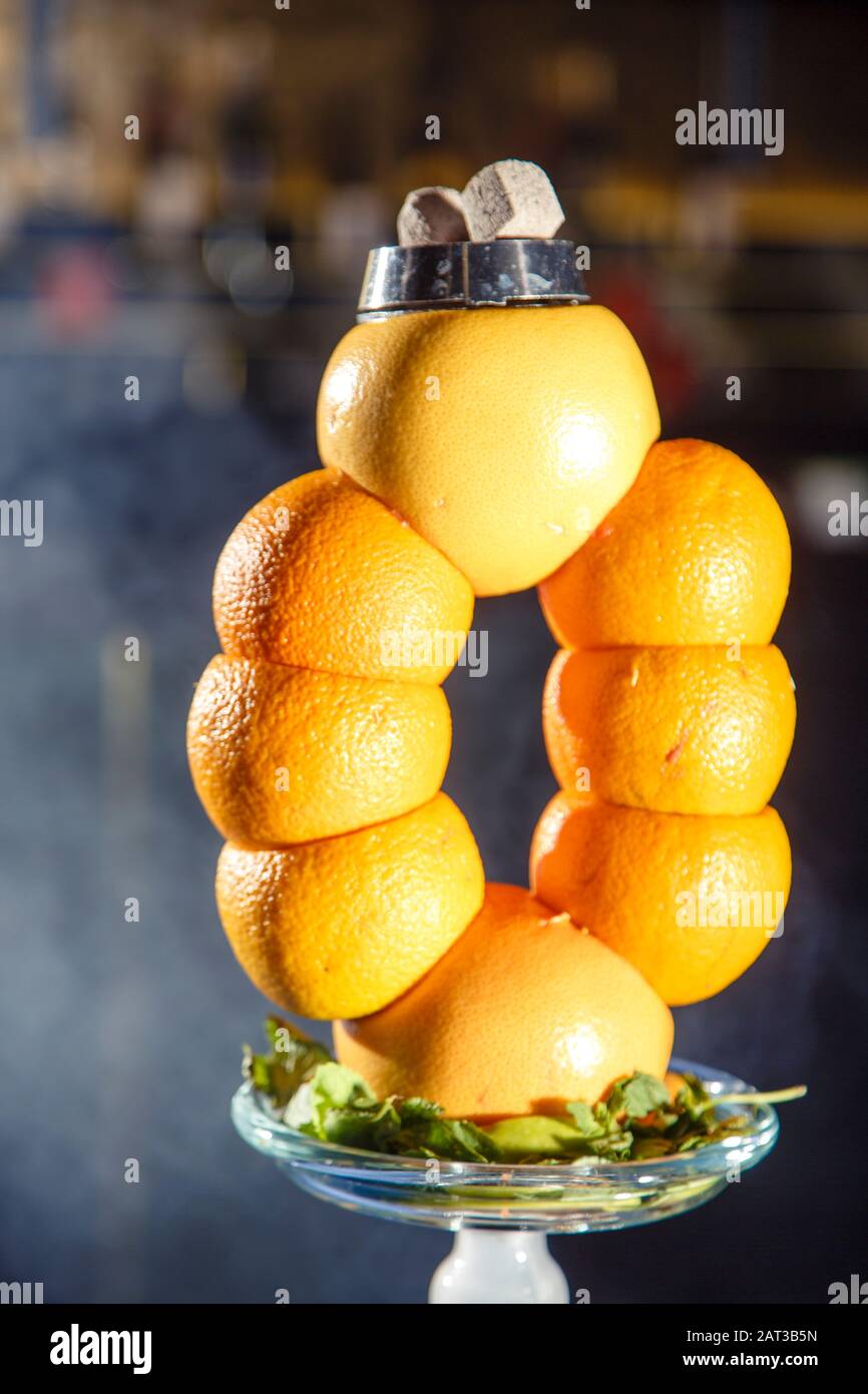 Hookah on the orange. Orange hookah. Hookah with a round transparent ...