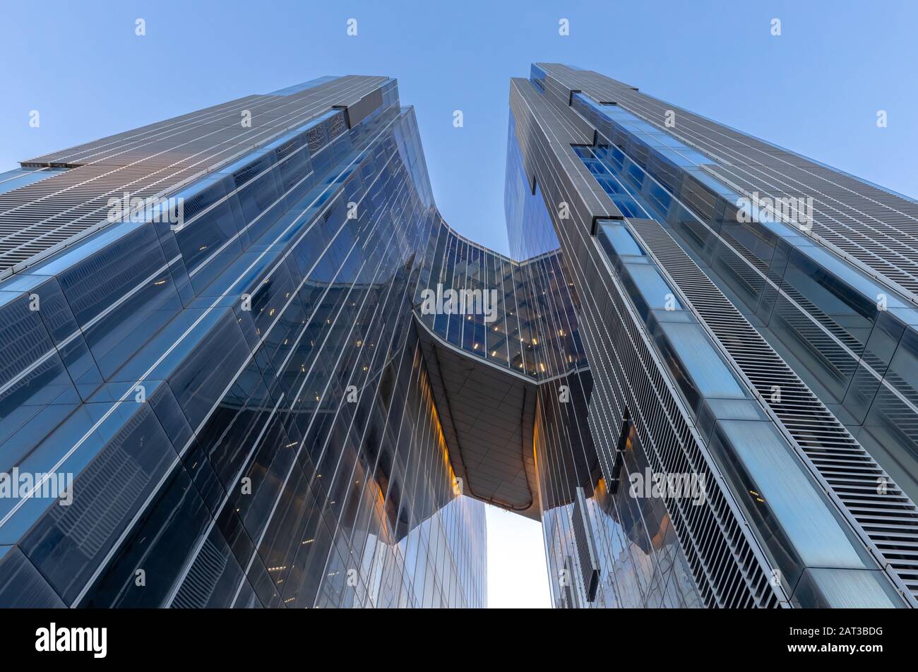 Bottom view shot of two buildings connected with a bridge Stock Photo ...