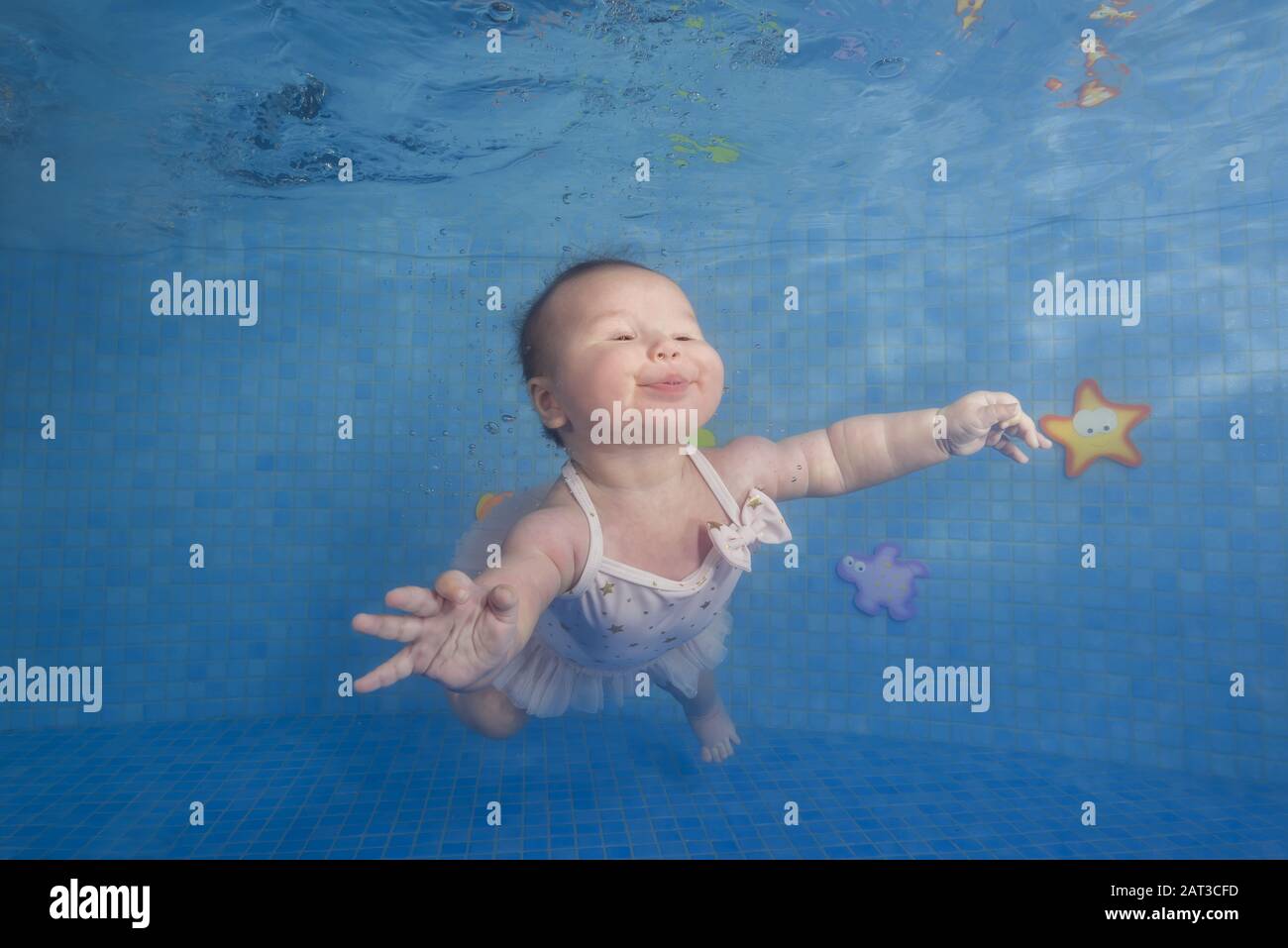 Person swimming in pool blue hi-res stock photography and images - Alamy