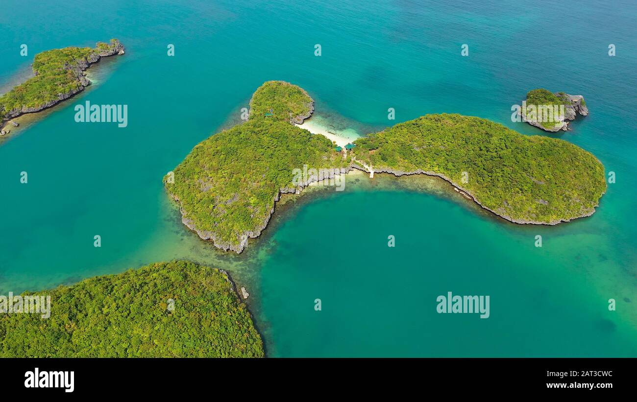 Seascape with a cluster of tropical Islands in turquoise water, aerial ...