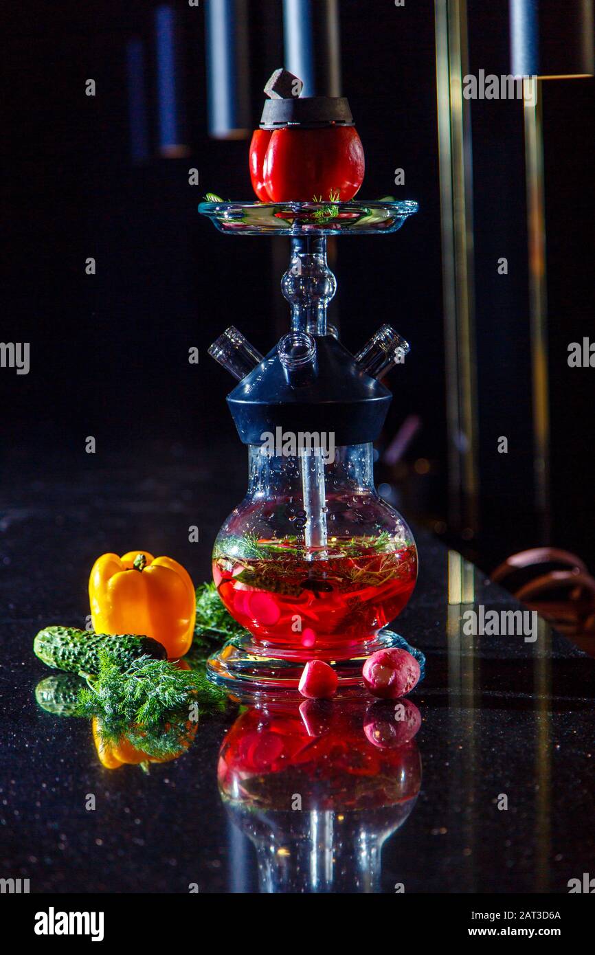 Hookah on vegetables. Hookah with a round transparent flask, which ...