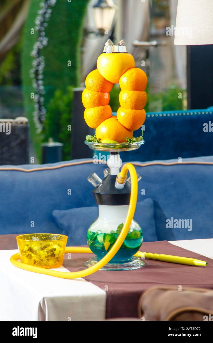 Hookah on the orange. Orange hookah. Hookah with a round transparent ...