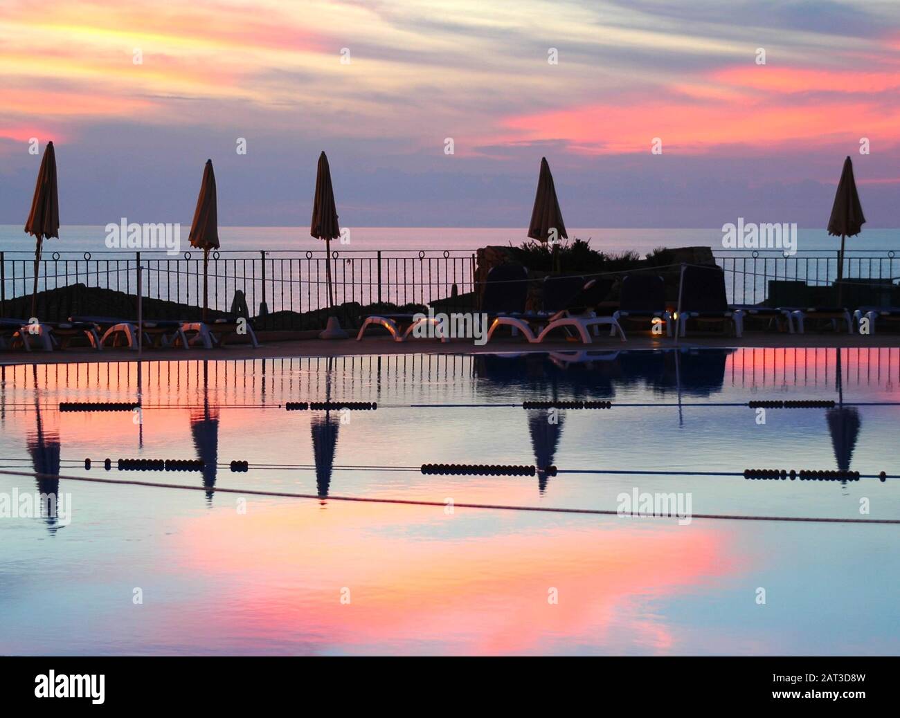 Sunset on swimming pool Stock Photo - Alamy