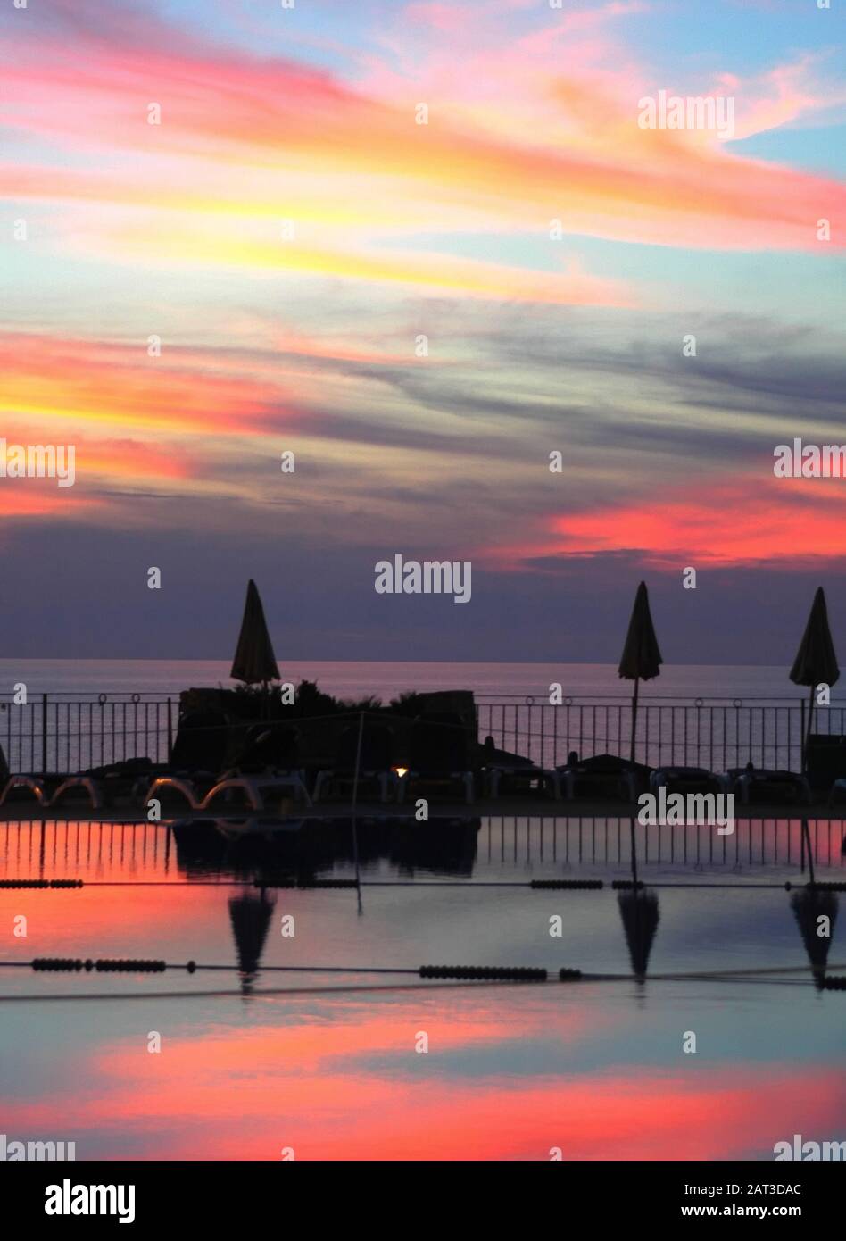 Sunset on swimming pool Stock Photo - Alamy