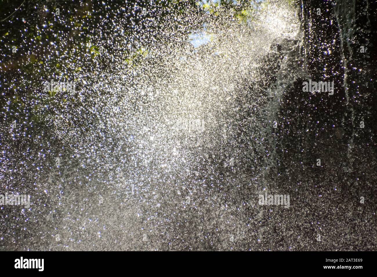 Low angle shot of a splash of water with a ray of sunlight Stock Photo ...