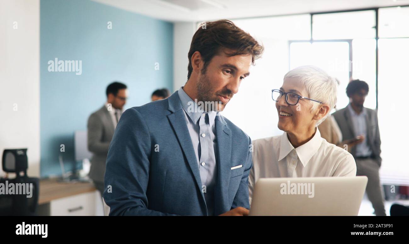 Group of successful business people at work in office Stock Photo - Alamy