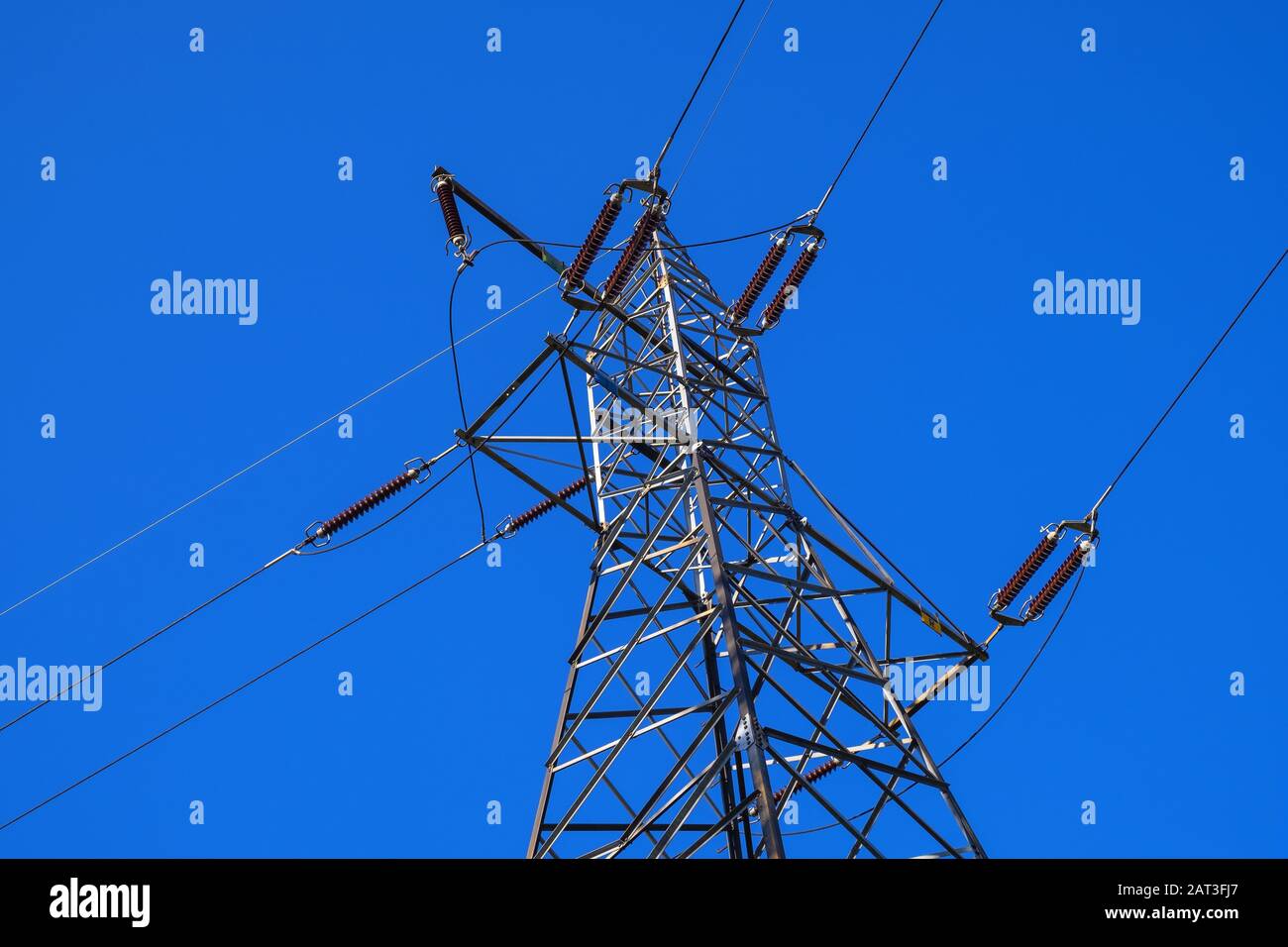 High voltage transmission line supported by the metal construction of a ...