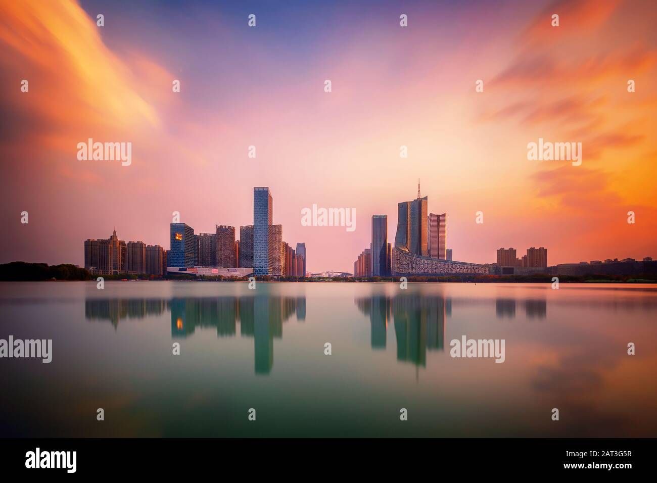 sunset over Swan Lake financial business district, Hefei city, China ...