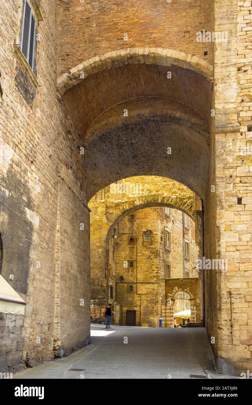 Perugia, Umbria / Italy - 2018/05/28: Medieval arch forming a gate to ...