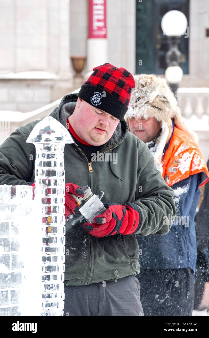 St. Paul, MN/USA - January 25, 2020: Ice sculptor at multi-block ice ...