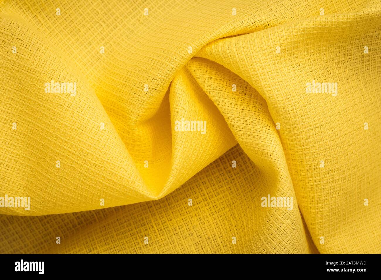Yellow cotton background of fabric, cage pattern. Linen textile folds ...