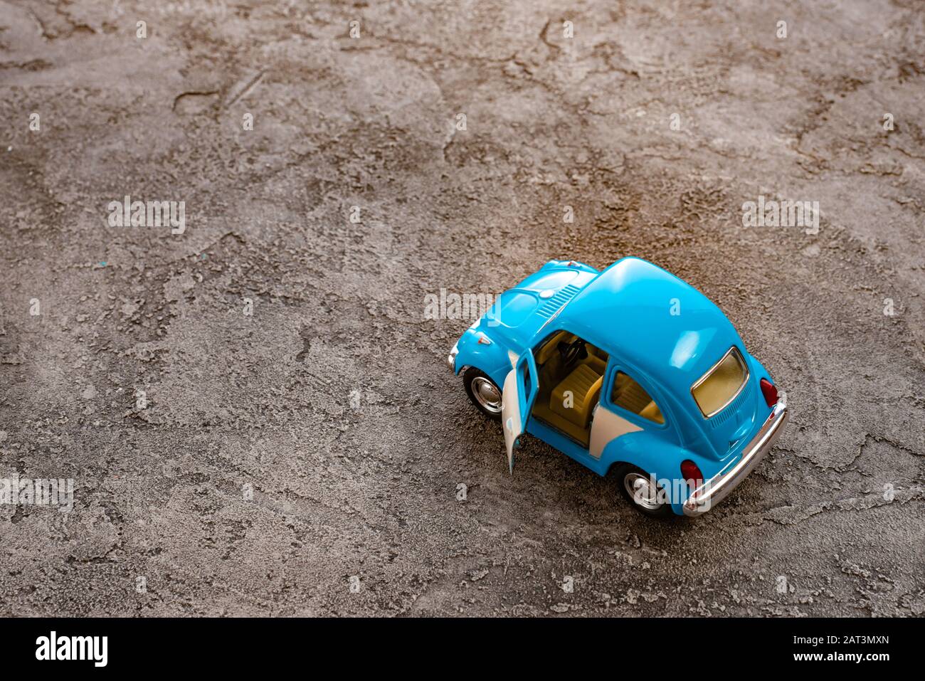 Close up of toy a retro car model with opening door on a color ...