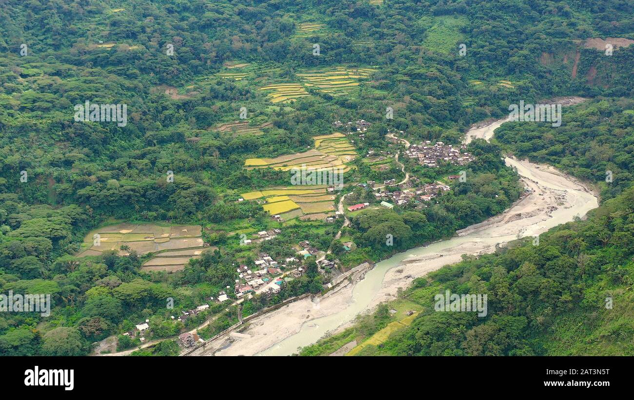 Village and river in a mountain gorge, top view. Rice cultivation in ...