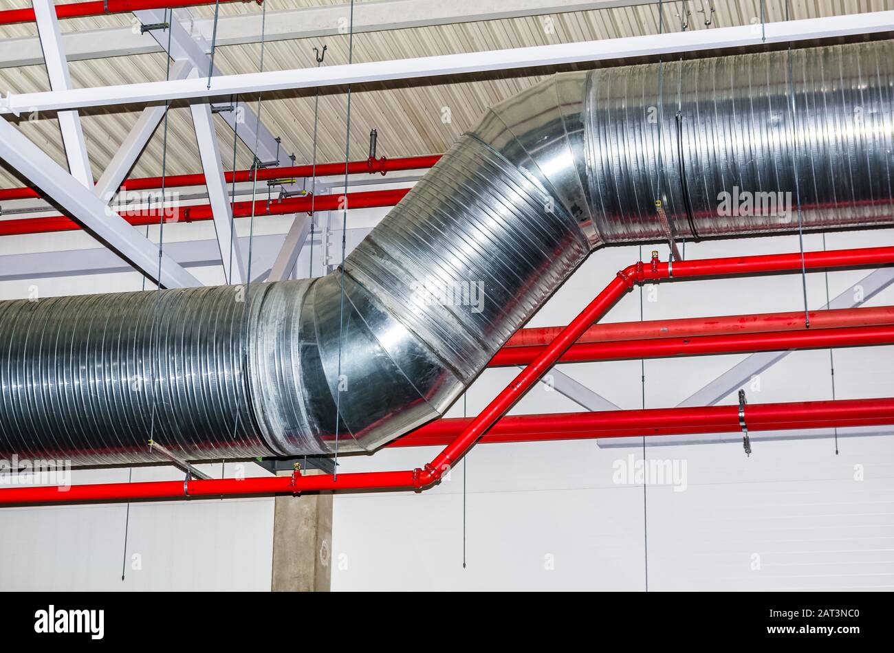 Pipes and other engineering services in industrial building Stock Photo ...