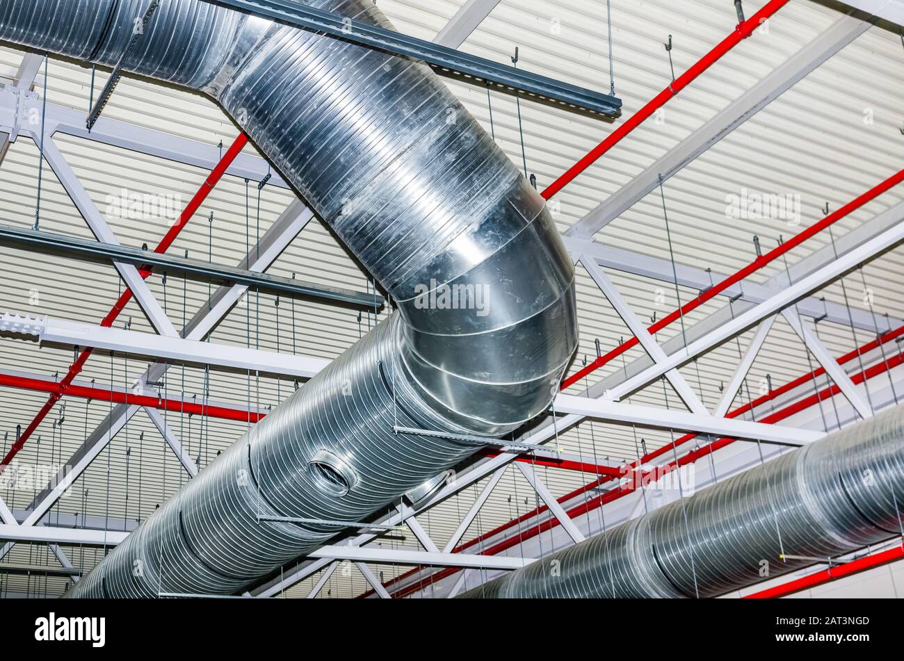 Pipes and other engineering services in industrial building Stock Photo ...