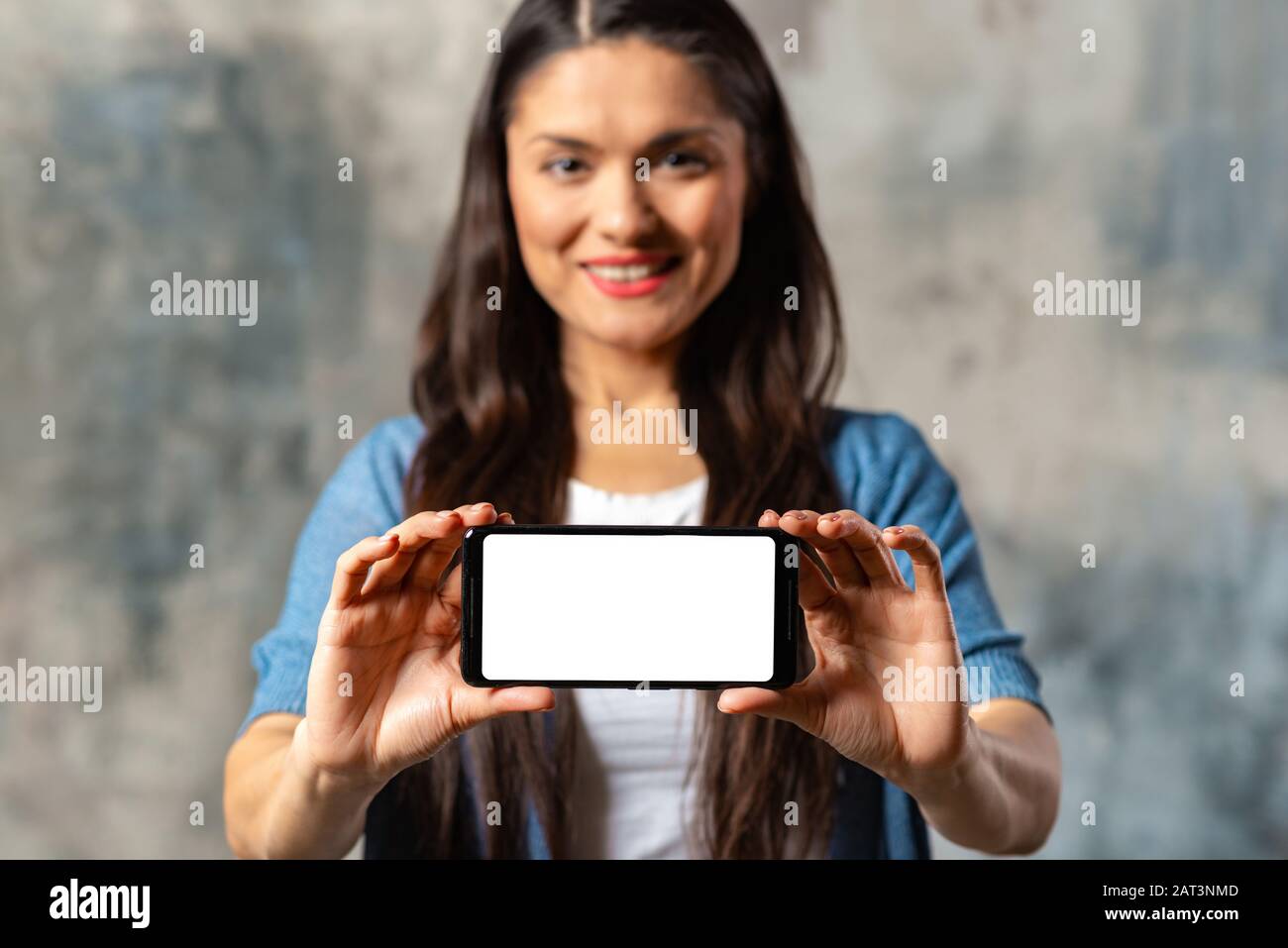 Woman showing screen of mobile phone. Focus on the smartphone.- Image ...