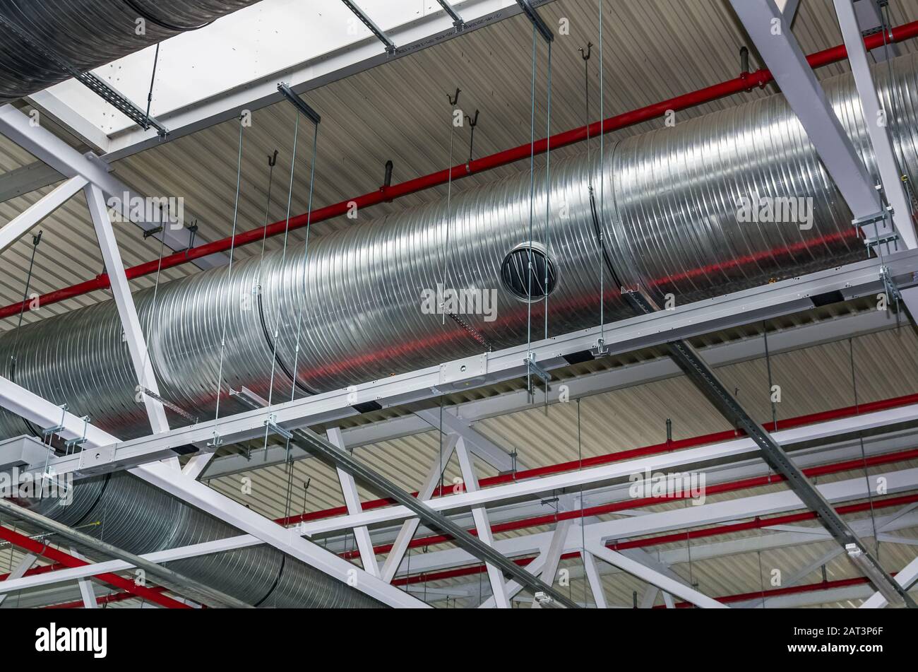 Pipes and other engineering services in industrial building Stock Photo ...