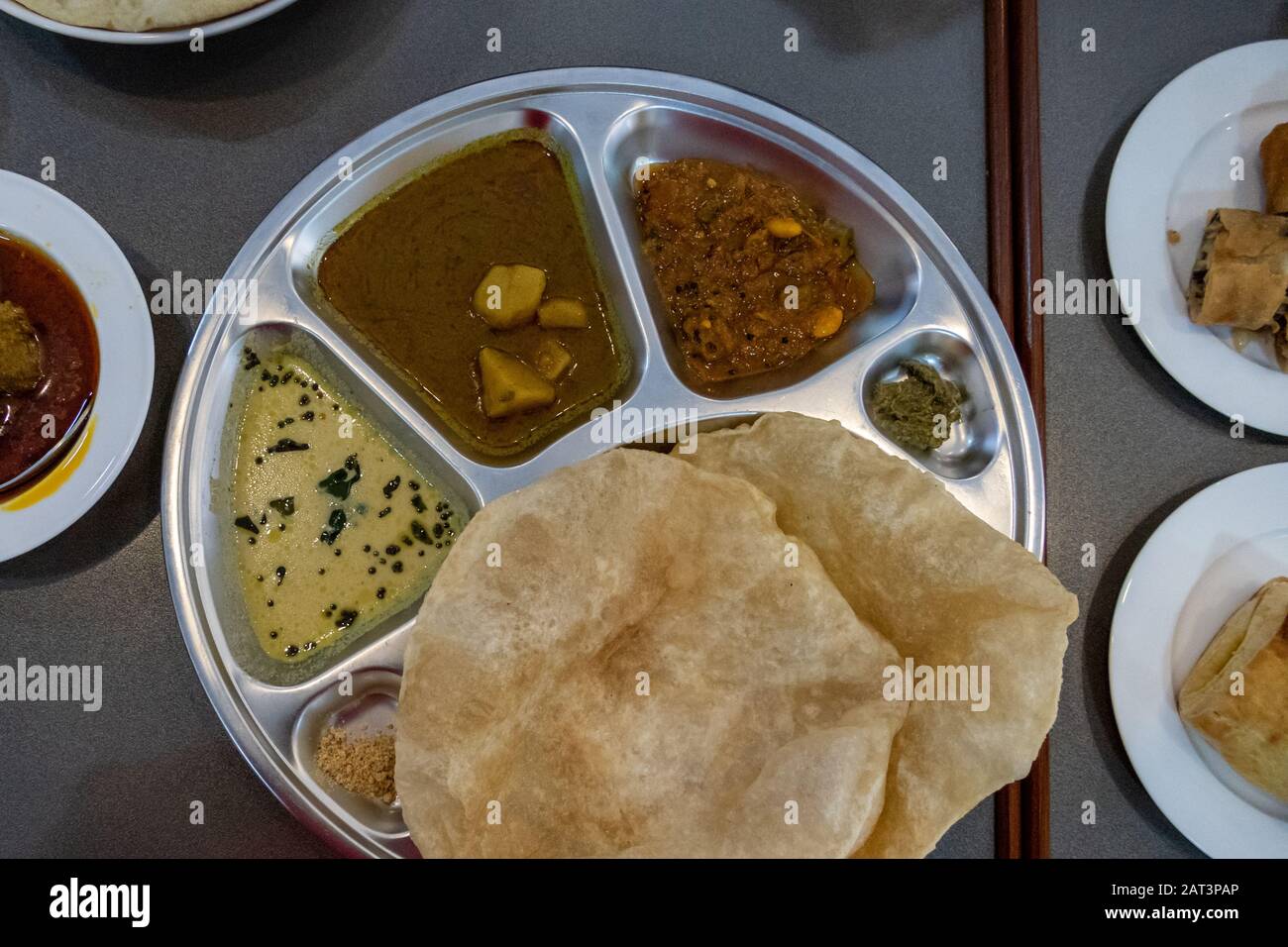 Burmese Naan Flatbread Served With A Variety Of Dipping Sauces Stock