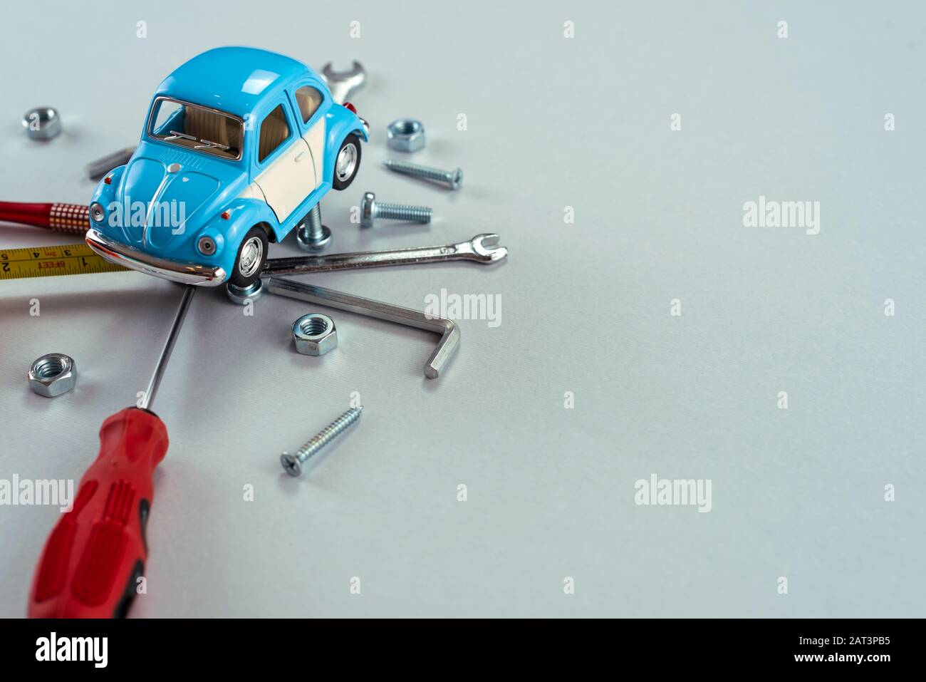 Set of tools wrenches with blue toy car. Car repair concept. - Image ...