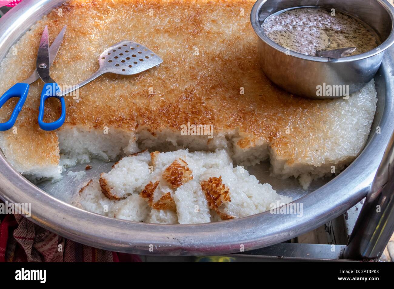 Burmese sticky rice coconut pudding in bowl Stock Photo - Alamy