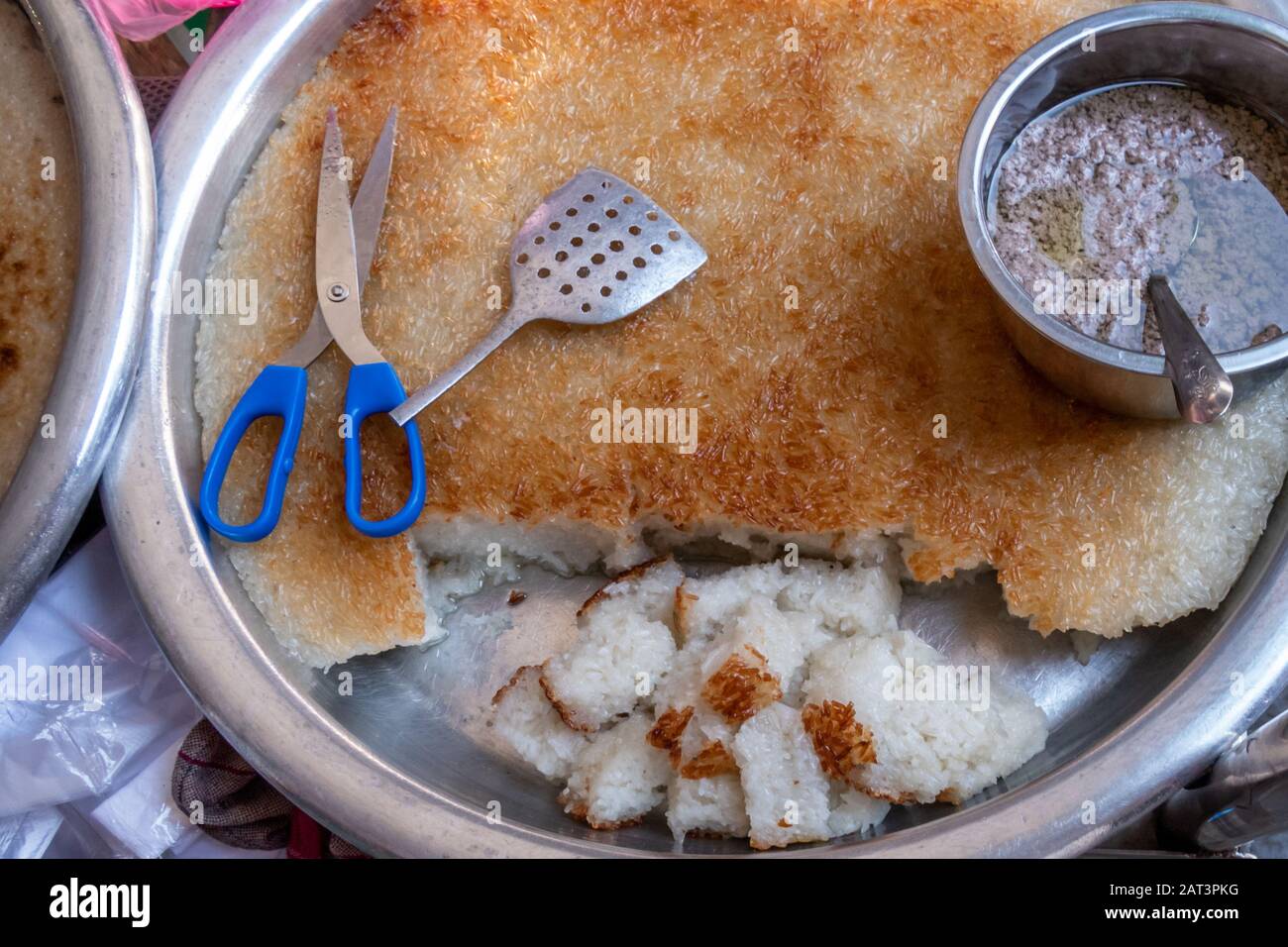 Burmese sticky rice coconut pudding in bowl Stock Photo - Alamy