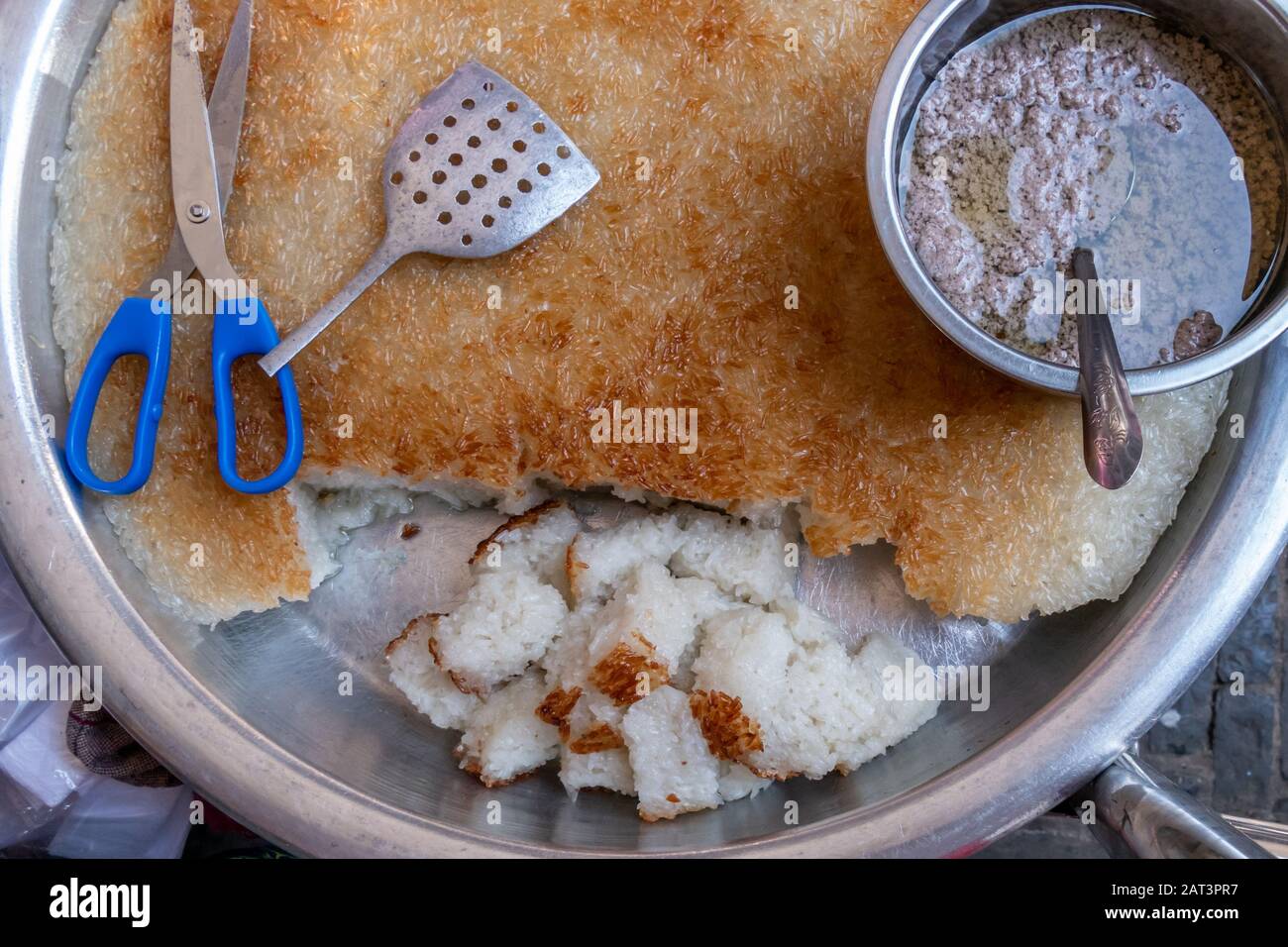 Burmese sticky rice coconut pudding in bowl Stock Photo - Alamy