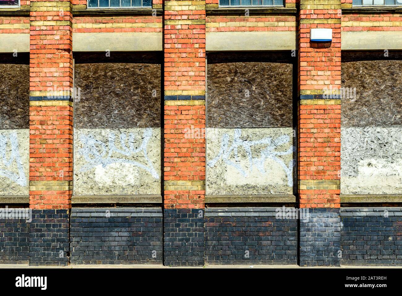 old brick factory building wall in england uk Stock Photo - Alamy