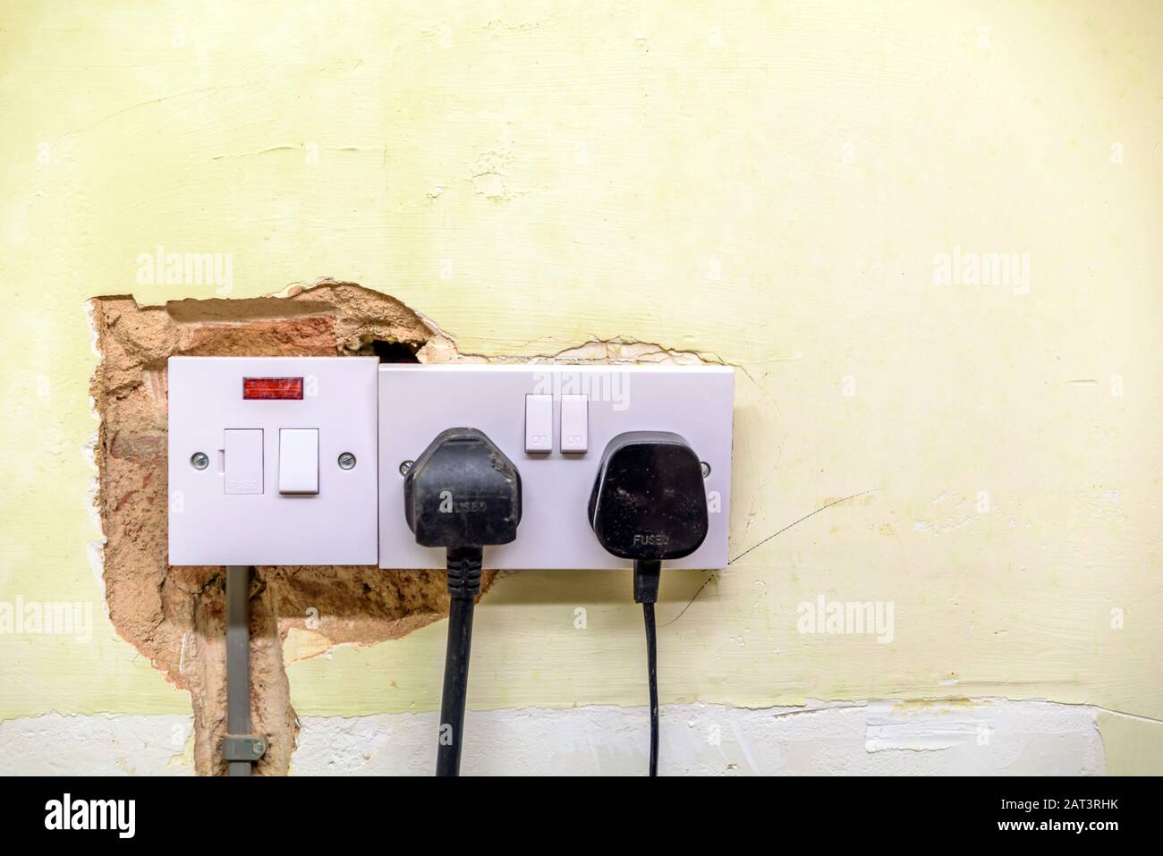 electric socket in a wall during renovation in england uk Stock Photo ...