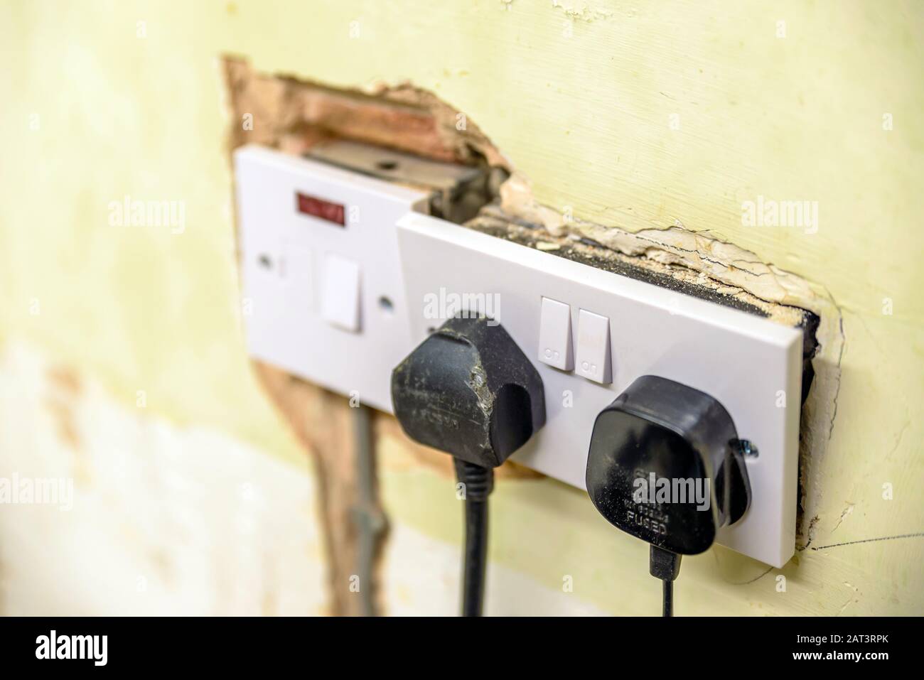 electric socket in a wall during renovation in england uk Stock Photo ...