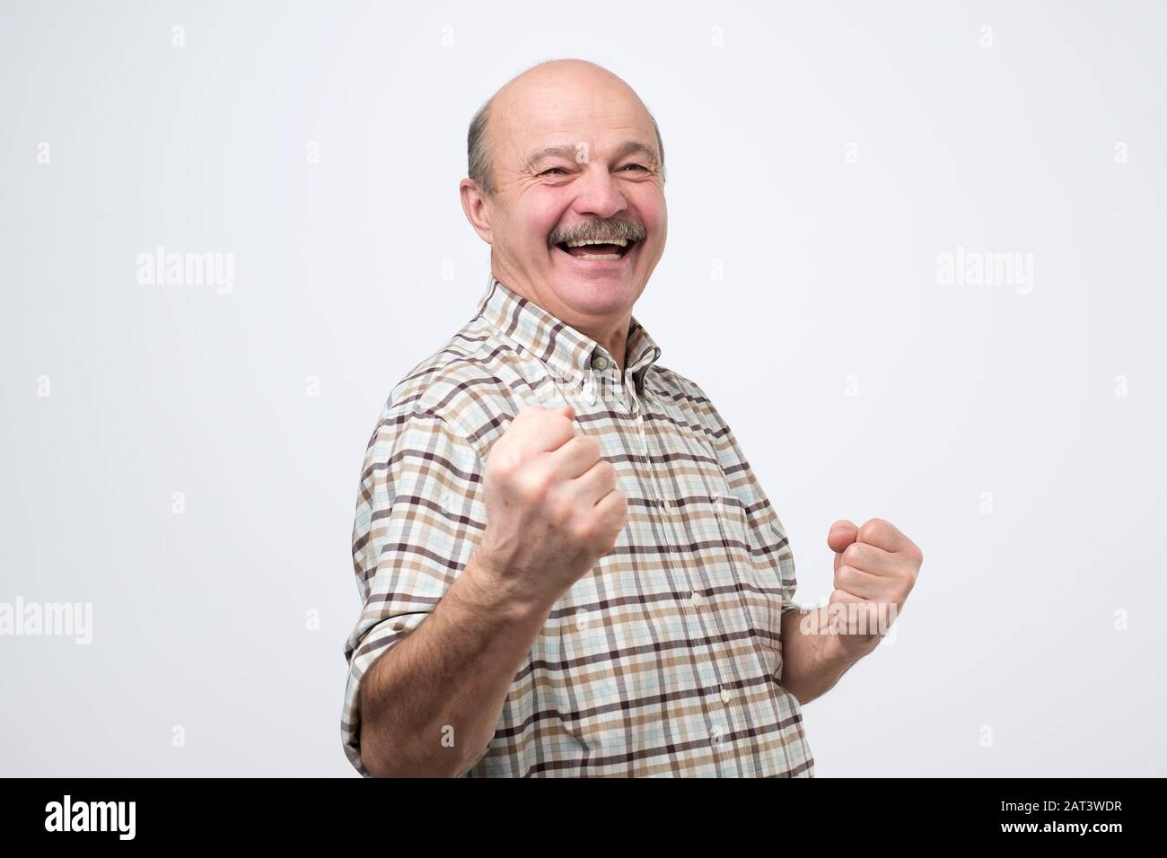 Handsome middle age man happy and excited celebrating victory ...