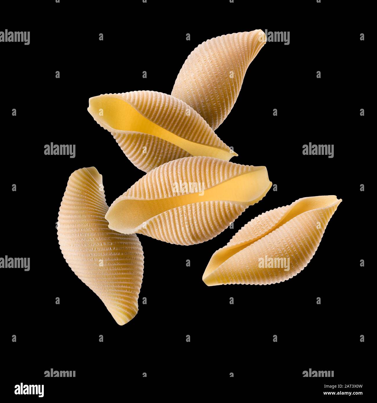 Conchiglie pasta shell composition isolated on black background Stock ...