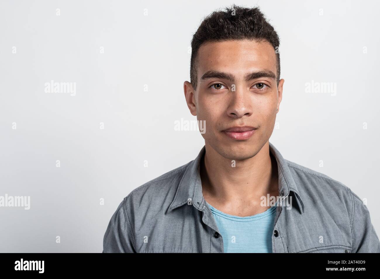 Closeup portrait of a mulatto man posing in the studio Stock Photo - Alamy