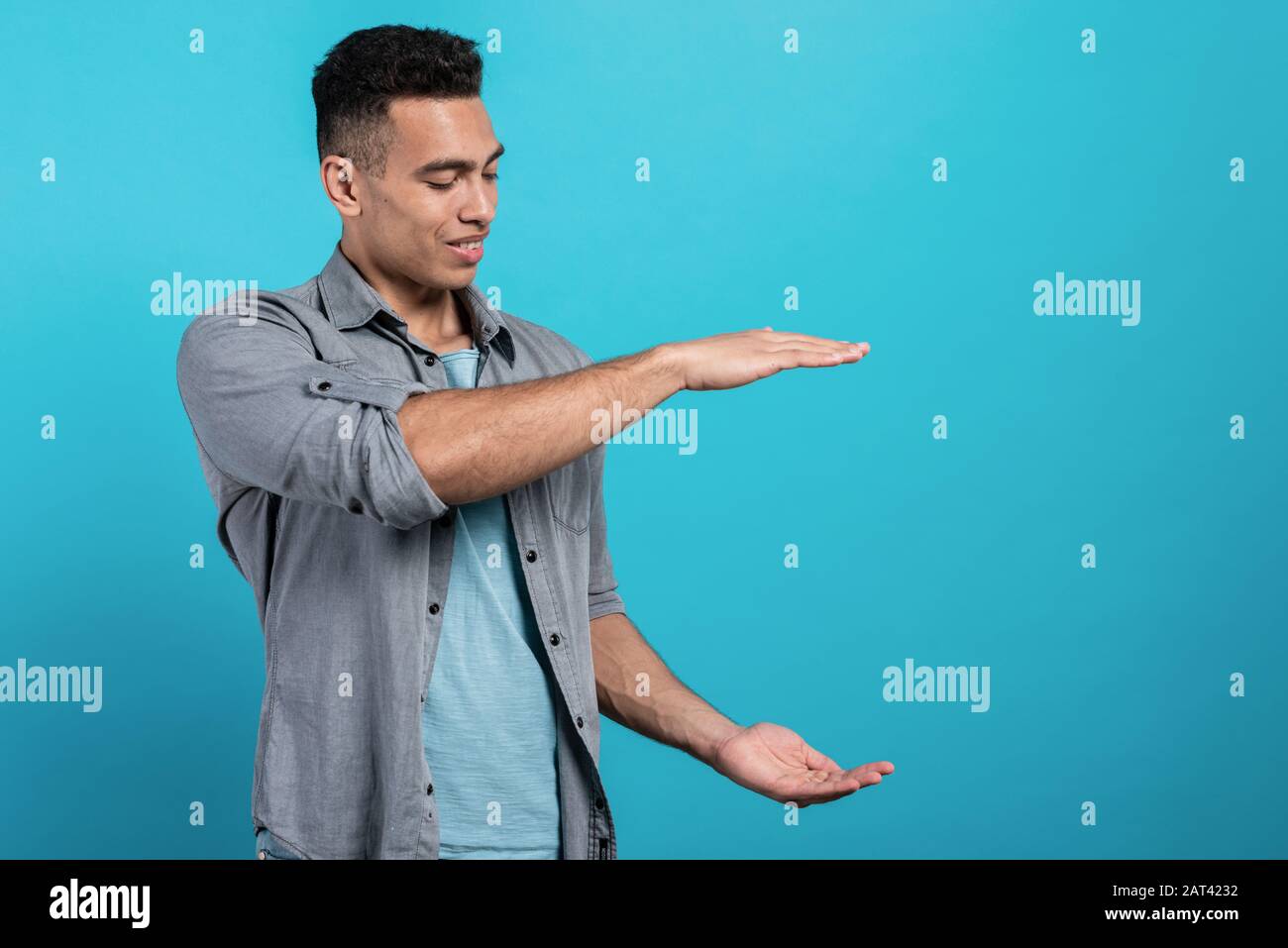 Person holding large object hi-res stock photography and images - Alamy