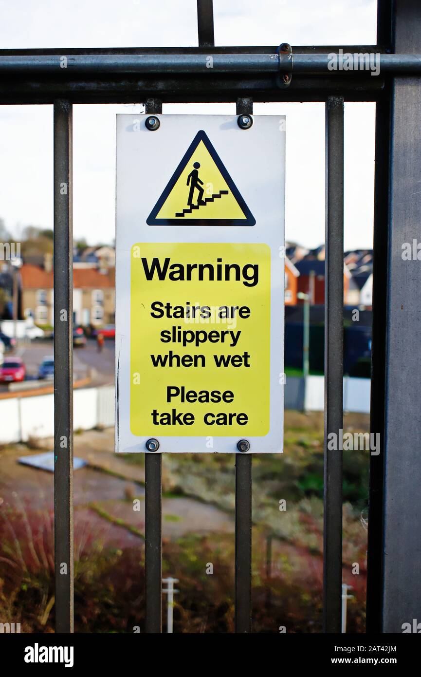 A yellow warning sign on a bridge in the UK Stock Photo - Alamy