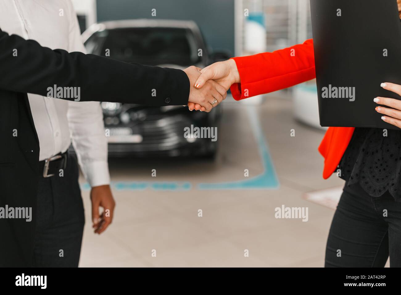 close-up handshake when meeting in car dealership- Image Stock Photo ...