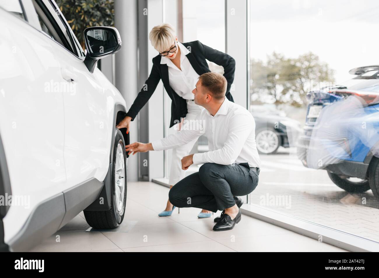 Woman next to an automobile hi-res stock photography and images - Alamy