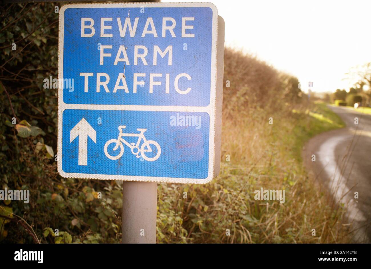 A warning sign for farm traffic on a country road in the UK Stock Photo ...