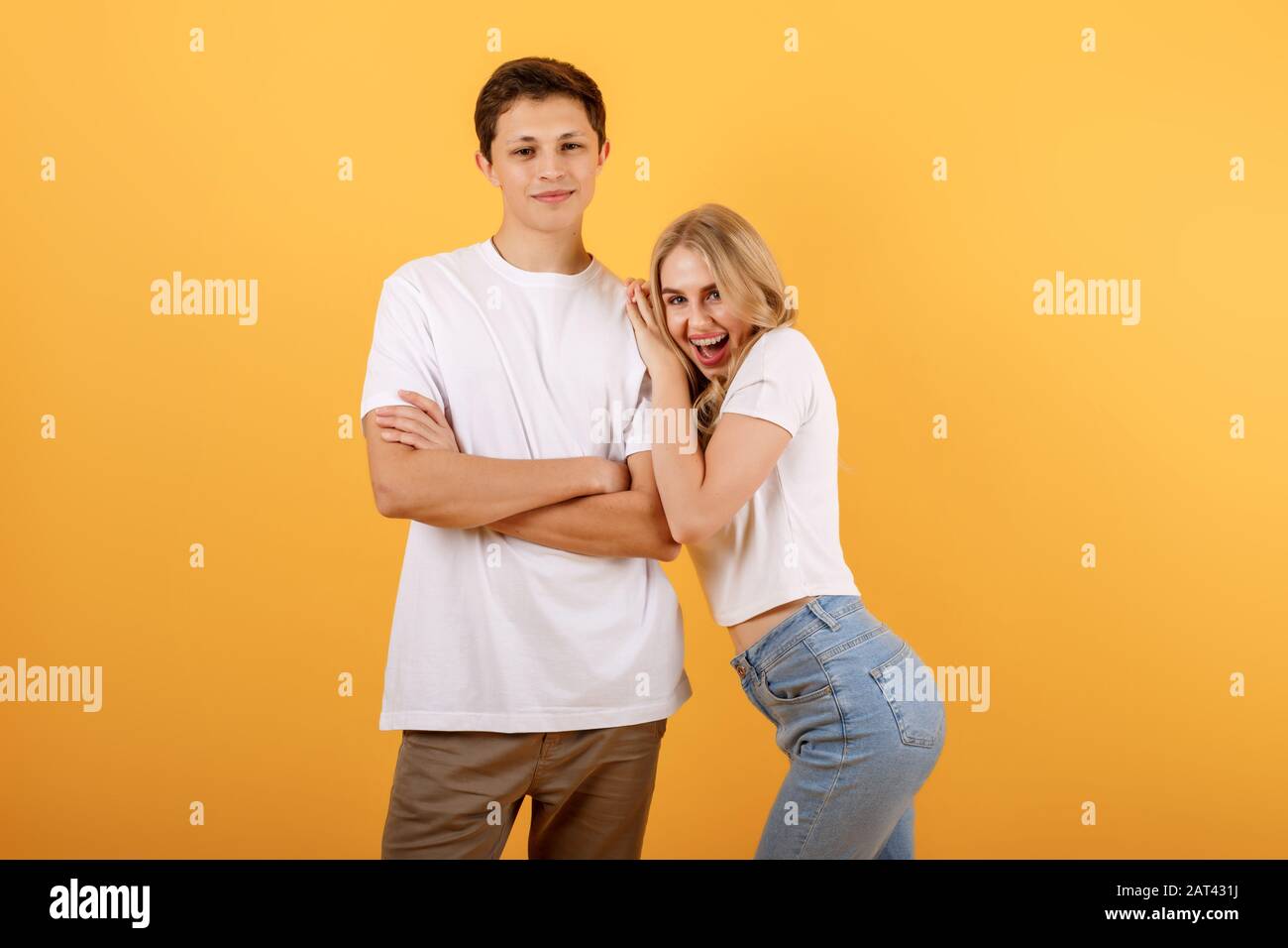 Happy woman leaning on the shoulder of a young man in a white t-shirt ...