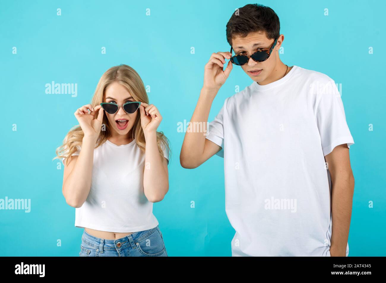 Surprised man and woman in glasses with open mouth Stock Photo - Alamy