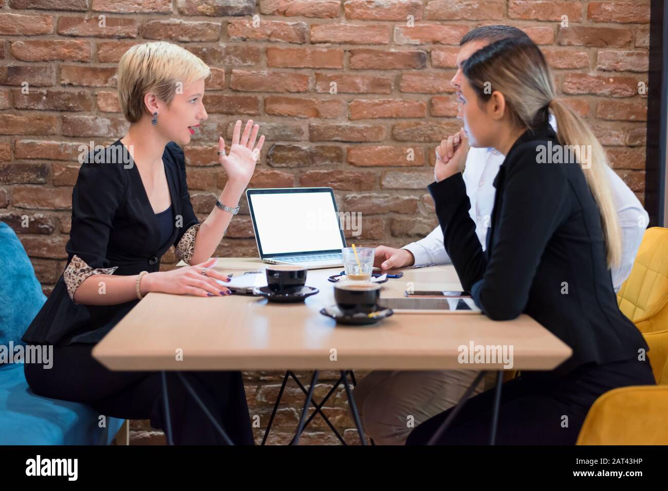 Full concentration at work. Group of young business people working and ...