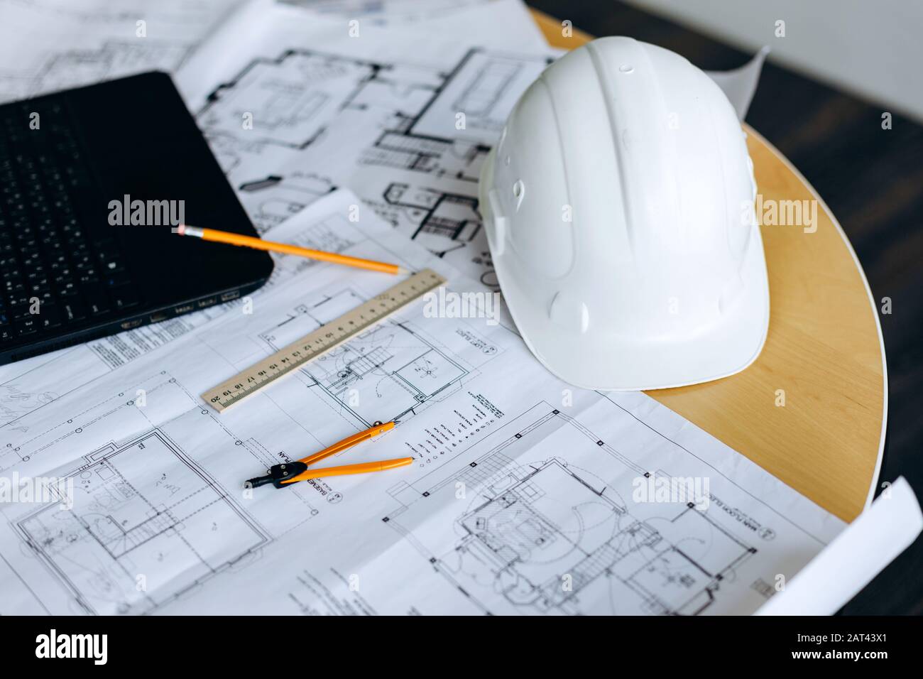 Engineering tools on wooden table with drawings Stock Photo - Alamy