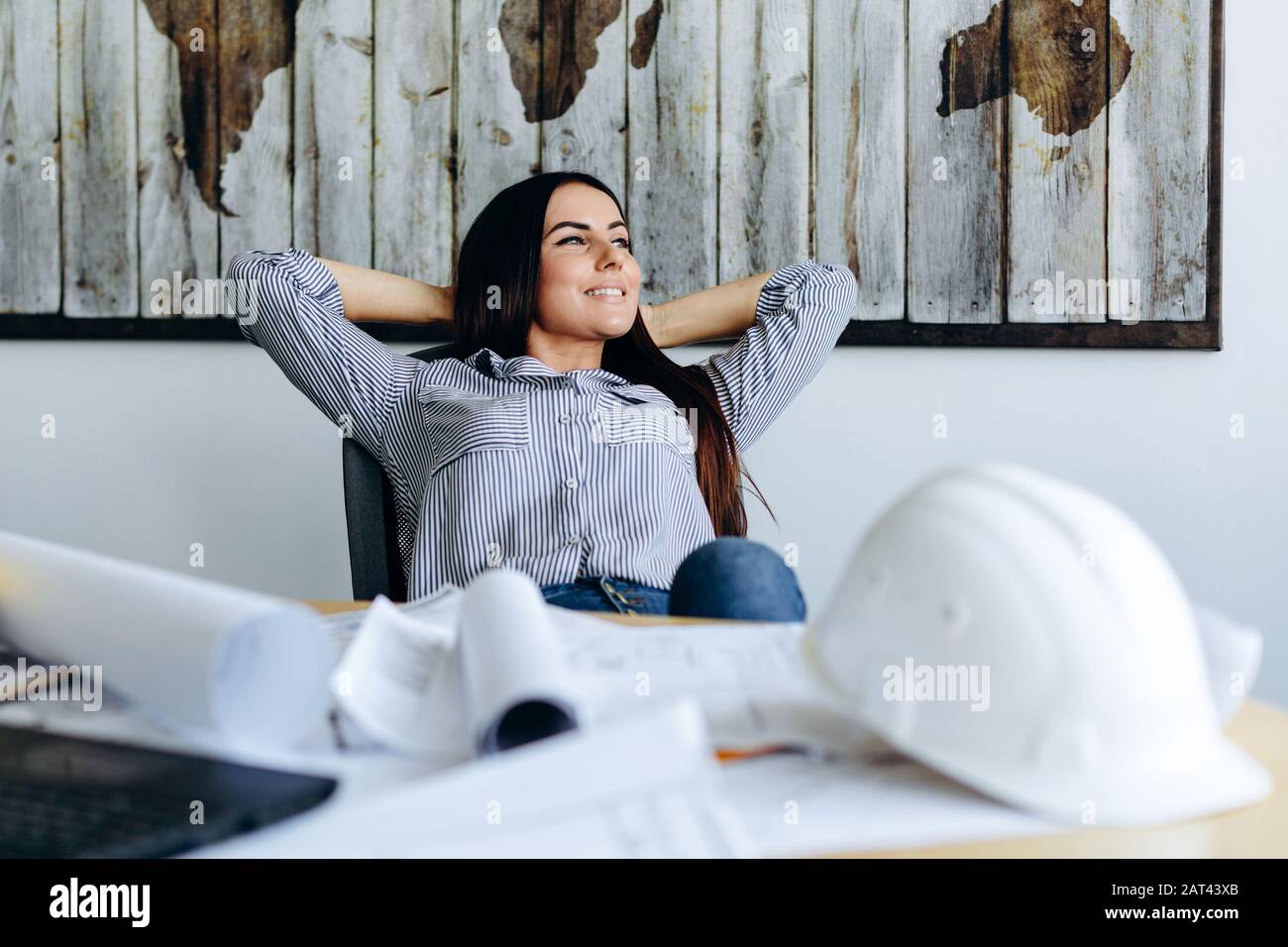 Leaning back in his chair hi-res stock photography and images - Alamy