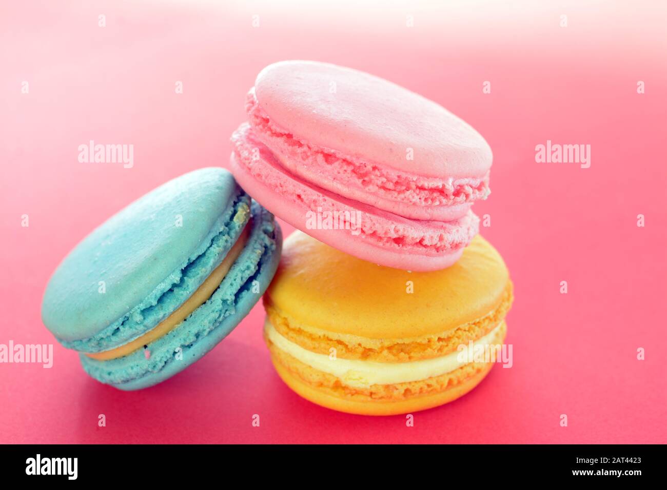 Three macaroon cakes on white background Stock Photo - Alamy