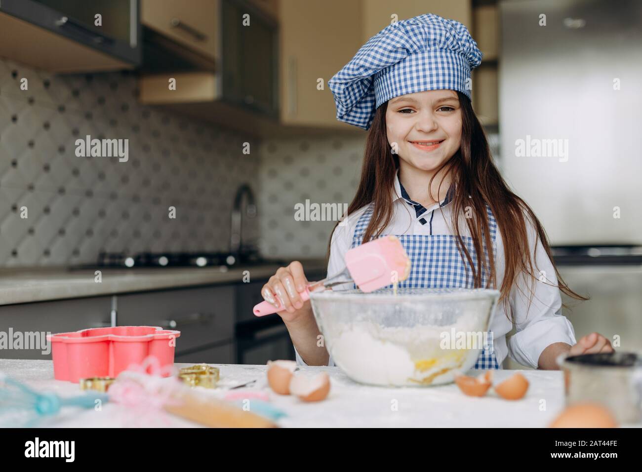 Happy girl cooking on the kitchen - Image Stock Photo - Alamy