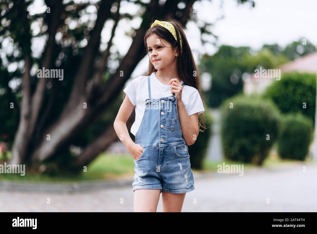 Portrait of cute little dirl standing and posing outdoor.- Image Stock ...