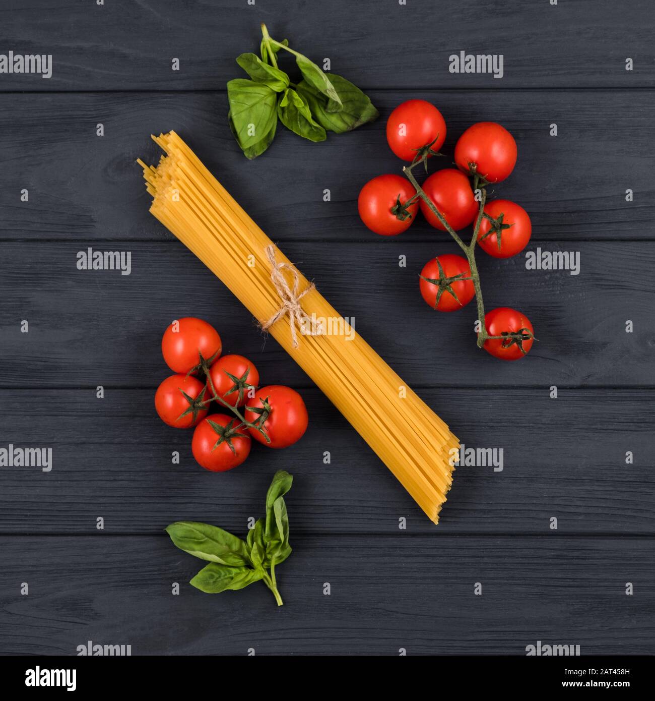 Tomatoes, basil, spaghetti. Top view. Concept of Italian cuisine Stock ...