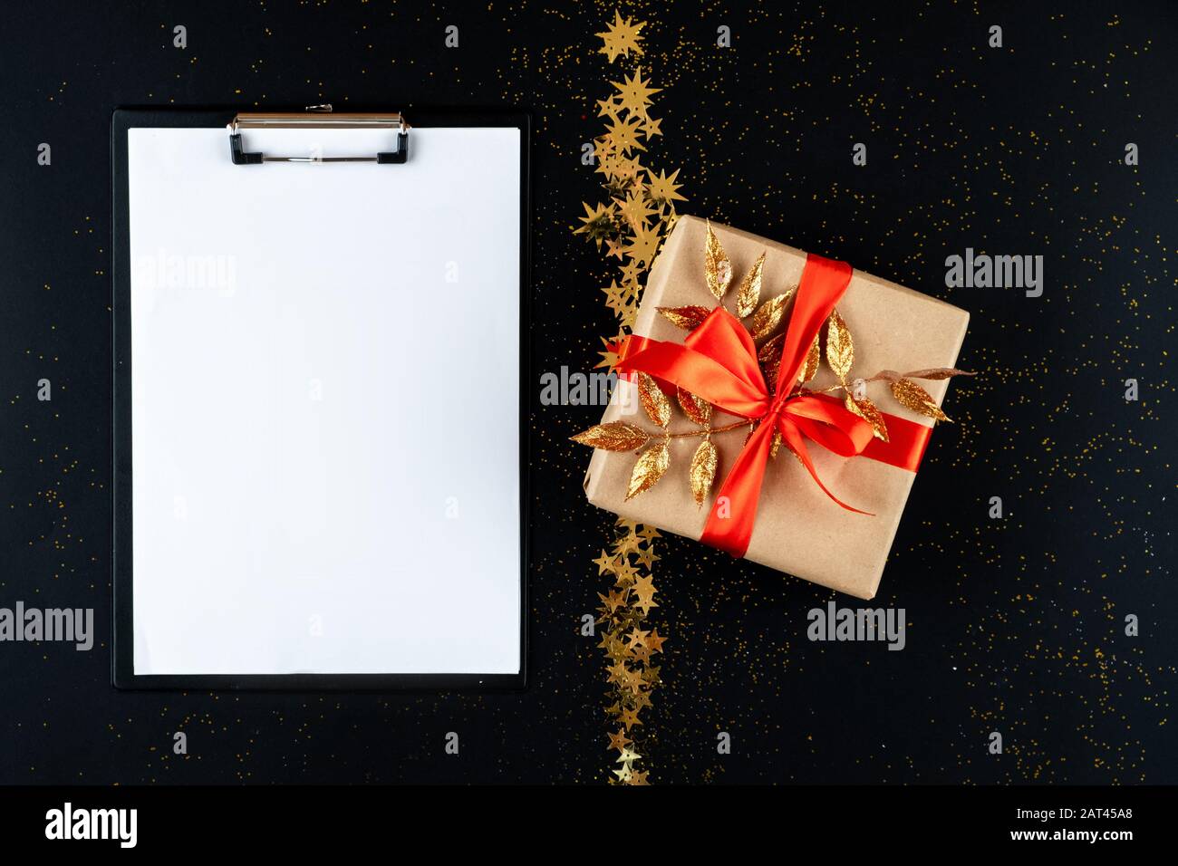 Christmas wish list with empty space for text on black background with ...