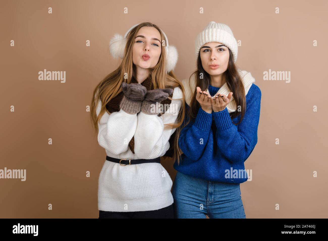 Young, adorable girls make an air kiss gesture Stock Photo - Alamy